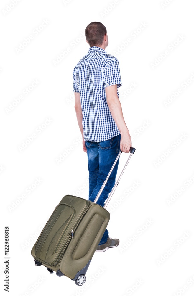 Back view of man with green suitcase looking up. Rear view people ...