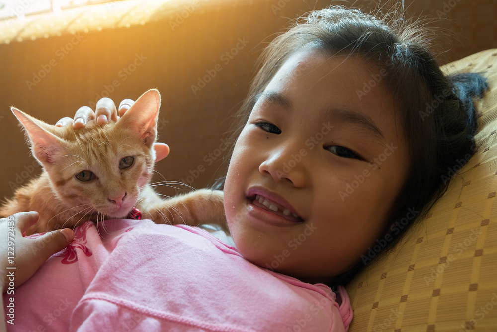 Cute little girl playing with thai cat, broken teeth and smiling,asian ...