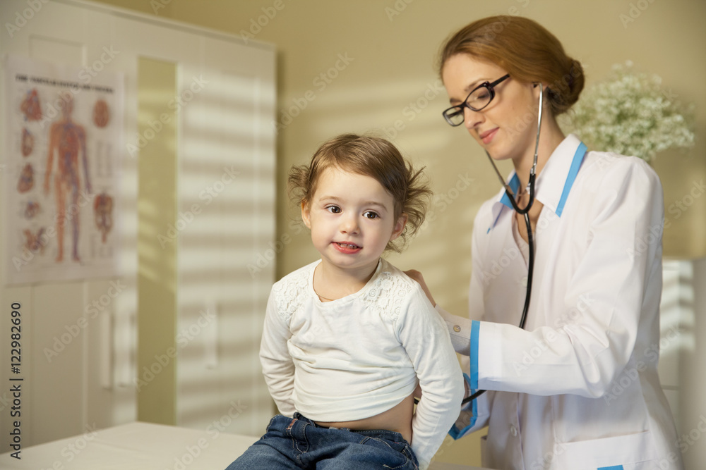 Cute little girl and doctor. Pediatrician woman examining cute little ...