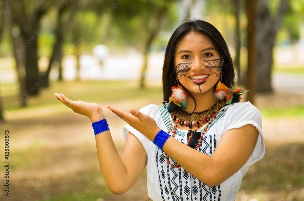 Beautiful Amazonian woman with indigenous facial paint and white ...