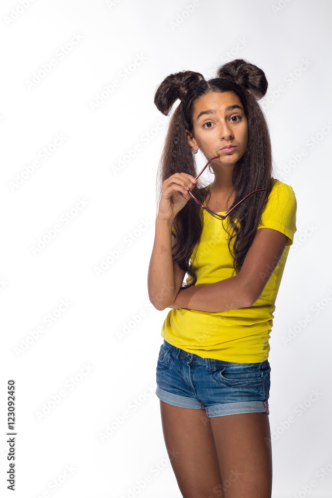 Emotional young brunette girl with long hair in yellow shirt and ...