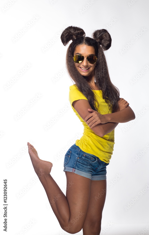 Emotional young brunette girl with long hair in yellow shirt and ...