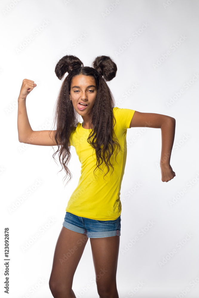 Emotional young brunette girl with long hair in yellow shirt on a white ...
