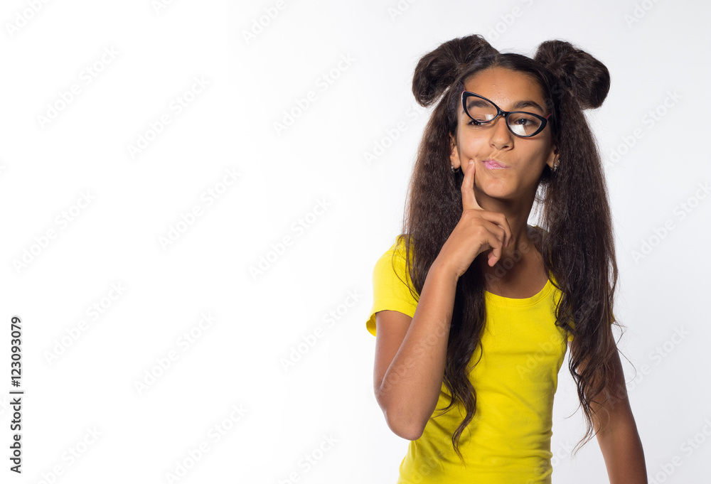Emotional young brunette girl with long hair in yellow shirt on a white ...