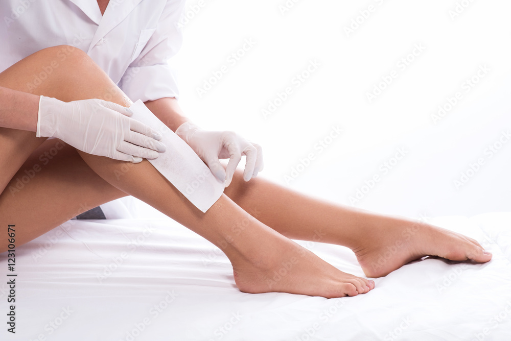 Professional cosmetician undergoing waxing procedure Stock Photo ...