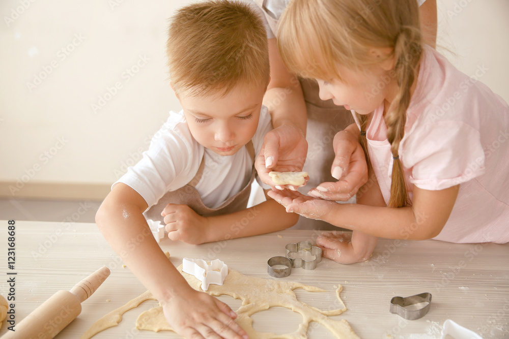 Mother and kids making biscuits Stock Photo | Adobe Stock