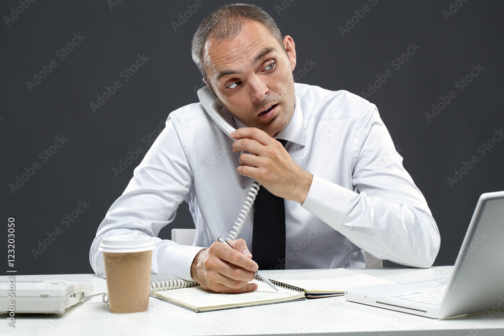 Portrait of manager talking on the phone at his workplace Stock Photo ...