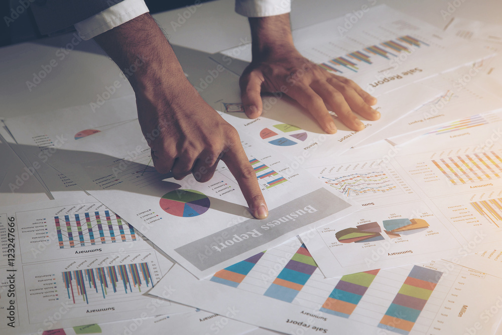 Image of male hand pointing at business report document Stock Photo ...