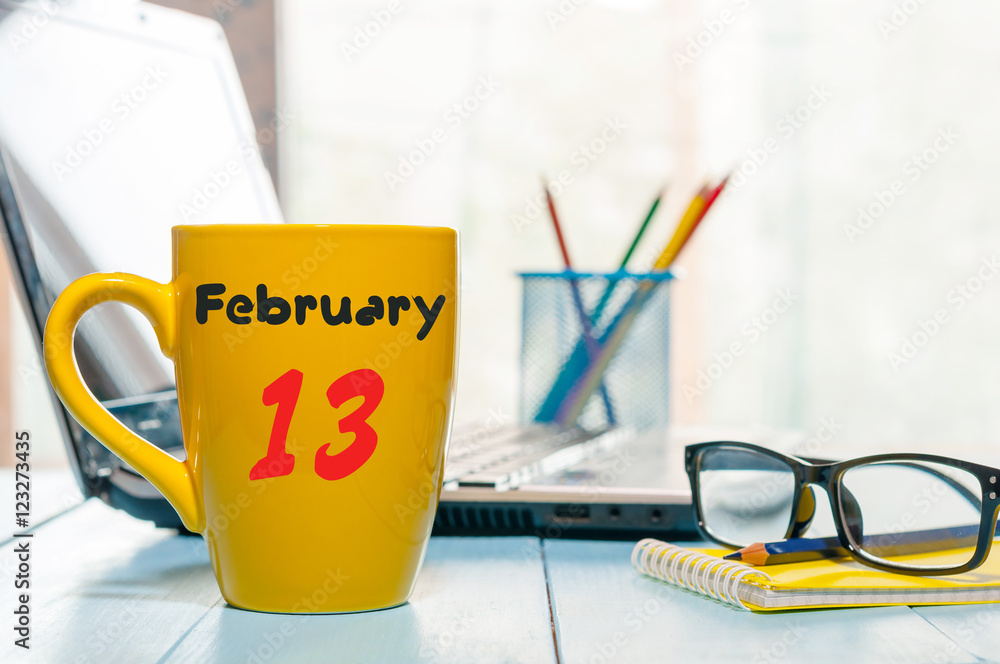 February 13th. Day 13 of month, calendar on designer workplace ...