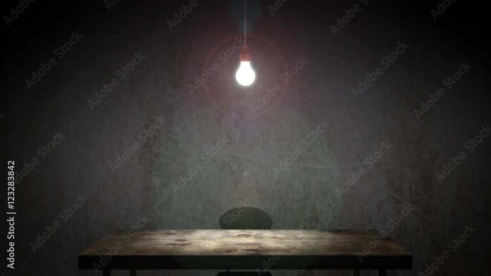 Video Stock A classic old interrogation room with swinging incandescent bulb. The camera slowly ...