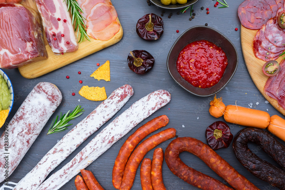 spanish tapas with salami, chorizo, lomo, jamon with red hol salsa ...