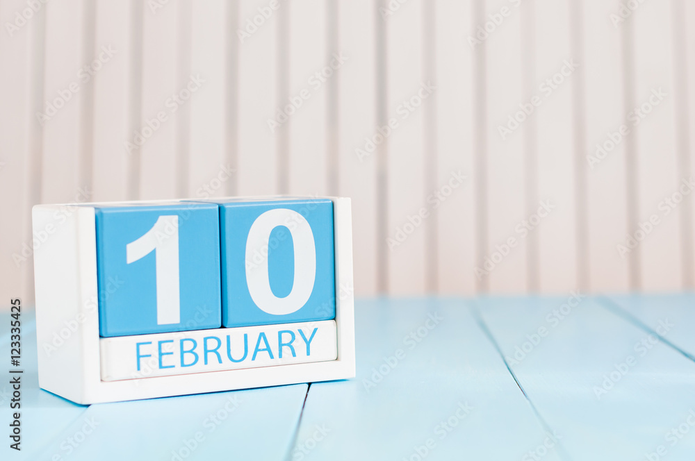 February 10th. Day 10 of month, calendar on wooden background. Winter ...