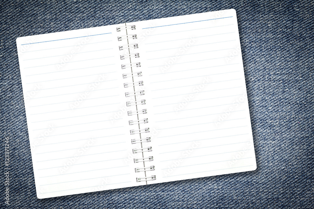 Open notebook paper page with line on denim jeans background for design ...