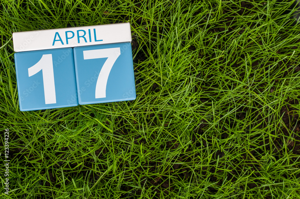 April 17th. Day 17 of month, calendar on football green grass ...