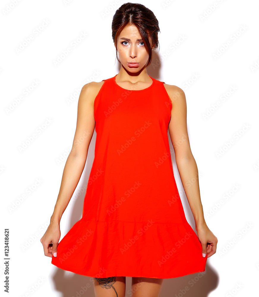 Portrait of fashion cute young girl model in a red dress on a white ...