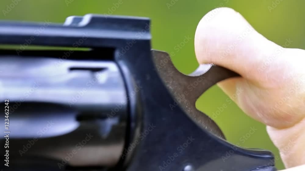 Man cocks and shoots. Man shoots a revolver. Soldier shoots a pistol ...