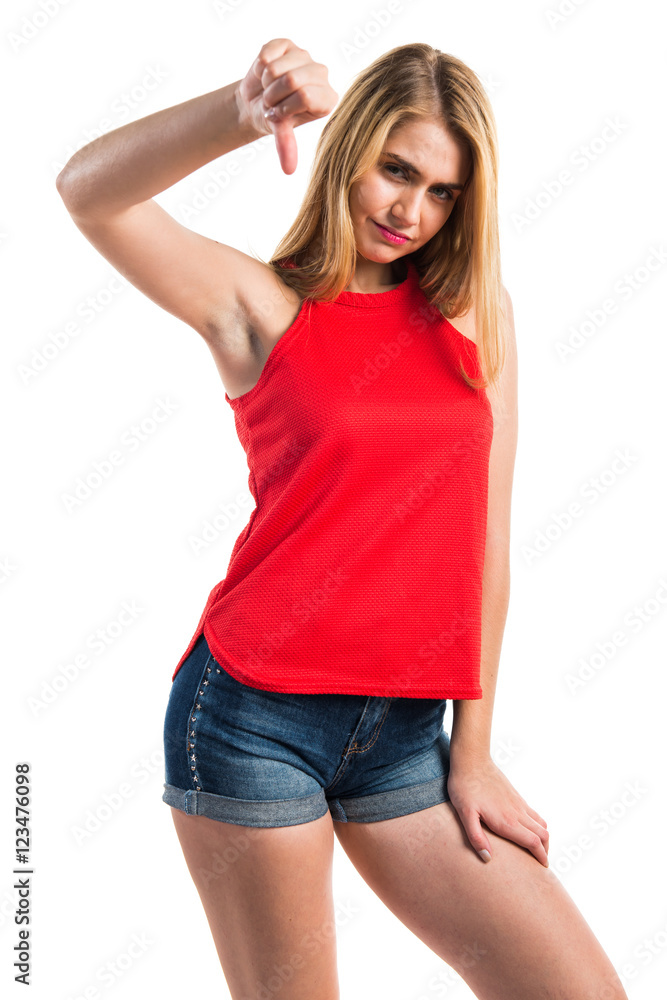 Blonde girl doing bad signal Stock Photo | Adobe Stock