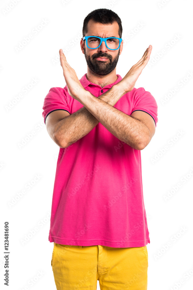 Man with colorful clothes doing NO gesture Stock-Foto | Adobe Stock