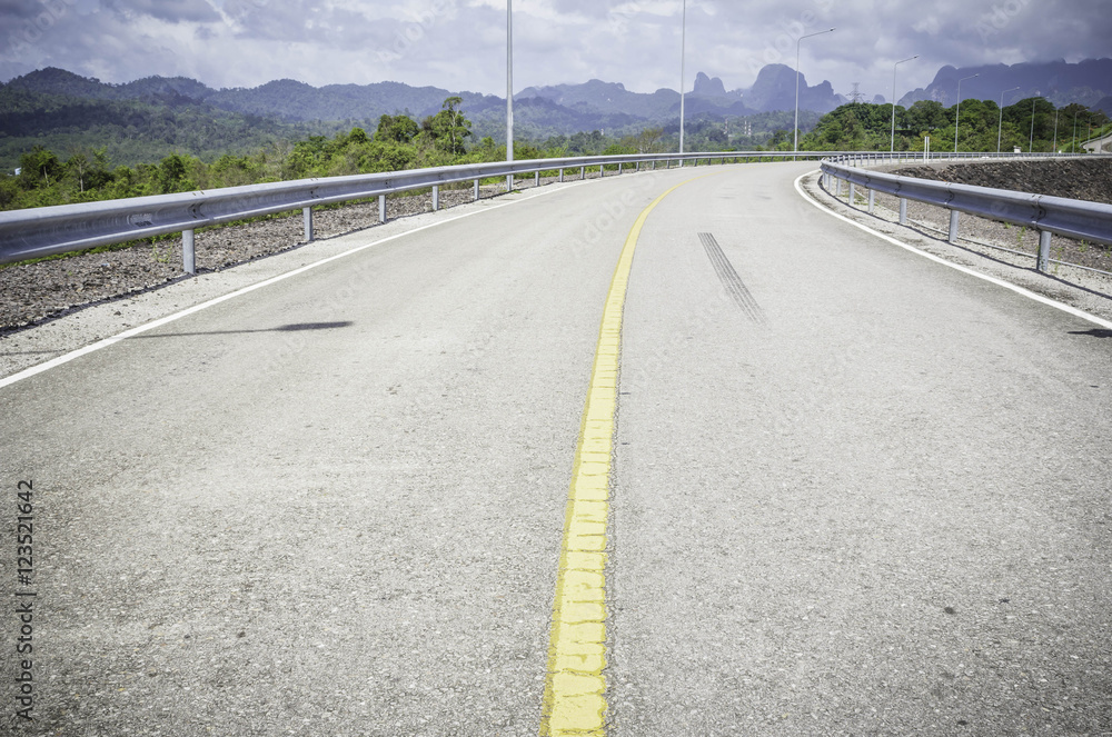 Road at ratchaprapa dam, Suratthani, Thailand. Stock Photo | Adobe Stock