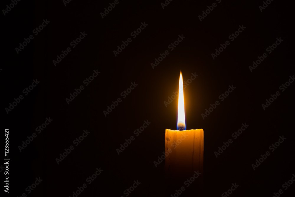 horizontal photo of candle with straight frame on black background with ...