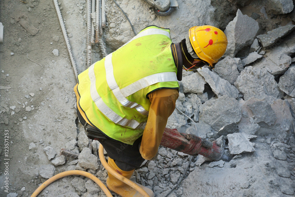 A construction workers cutting foundation pile using hacking method at ...
