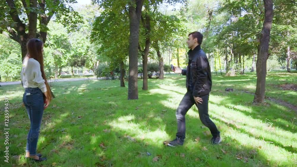 Woman jumps and man makes photo of it iand show it to her n slow motion ...