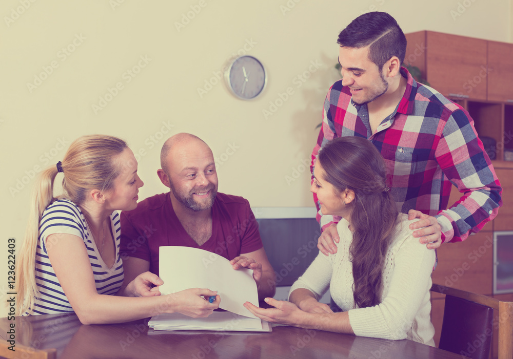 Two couples discussing and smiling Stock Photo | Adobe Stock