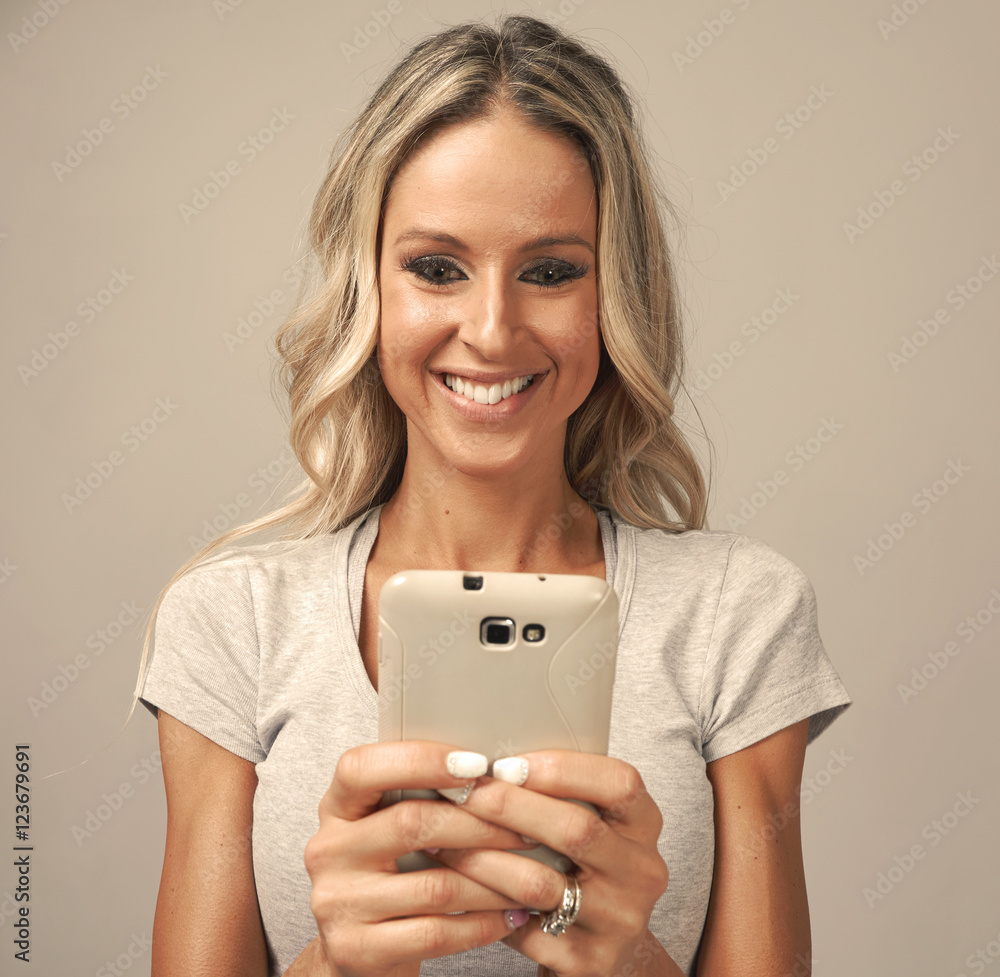 Beautiful girl with smartphone. Stock-Foto | Adobe Stock