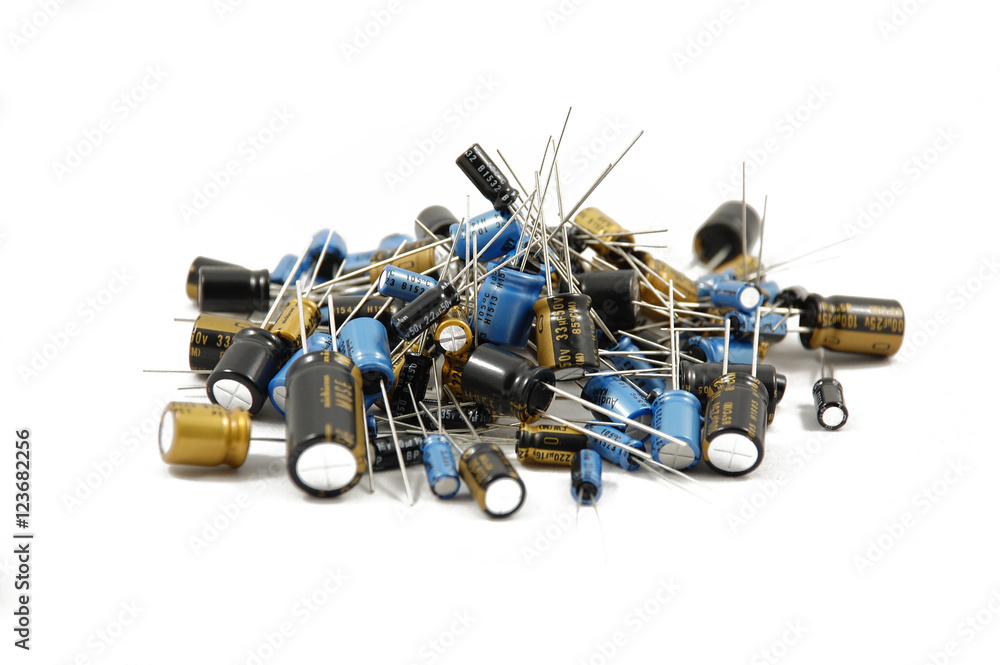 Lots of capacitors on white background wallpaper Stock Photo | Adobe Stock