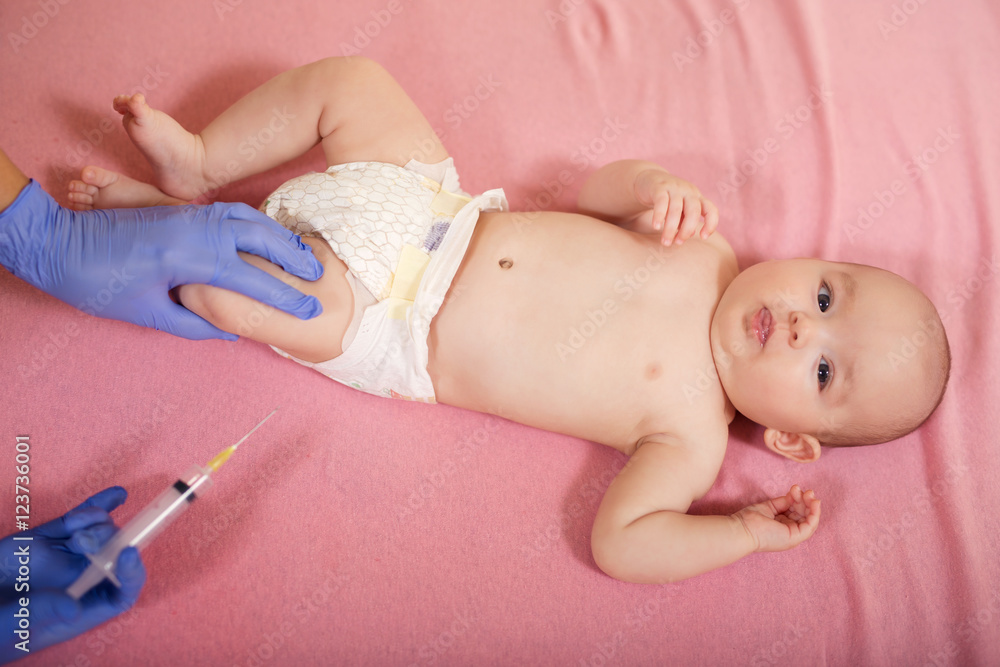 Baby receiving vaccine. Pediatrician giving a baby girl intramus Stock ...