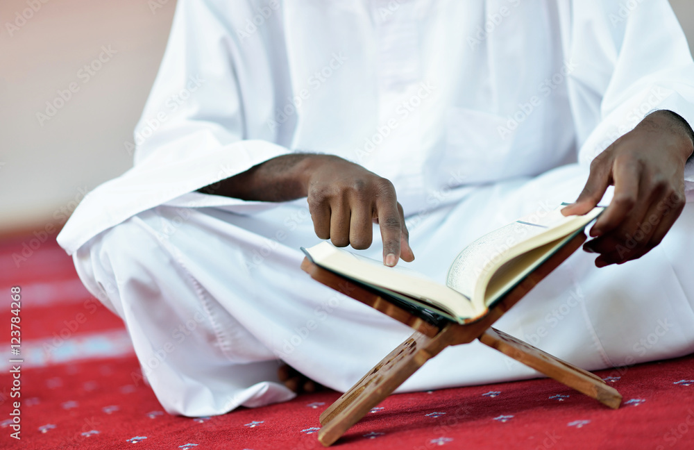 African Muslim Man Making Traditional Prayer To God While Wearing A ...