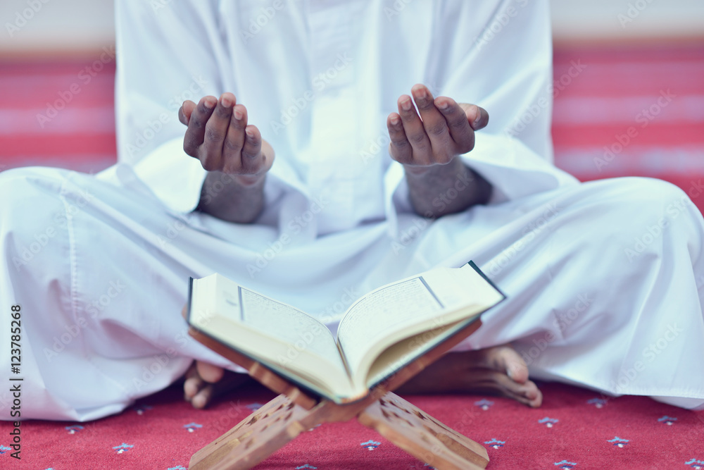 African Muslim Man Making Traditional Prayer To God While Wearing A ...