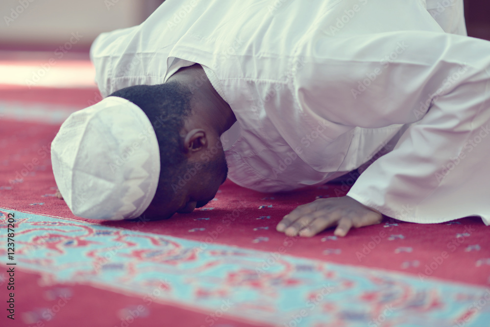 African Muslim Man Making Traditional Prayer To God While Wearing A ...