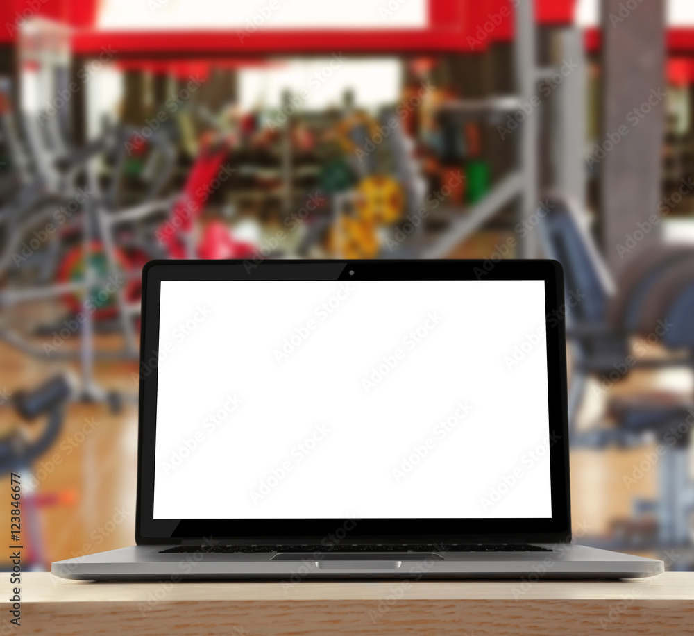 Laptop with blank screen on blurred gym background Stock Photo | Adobe ...