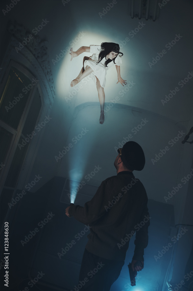 Poster Spooky monster on the ceiling looking down at the security guard ...