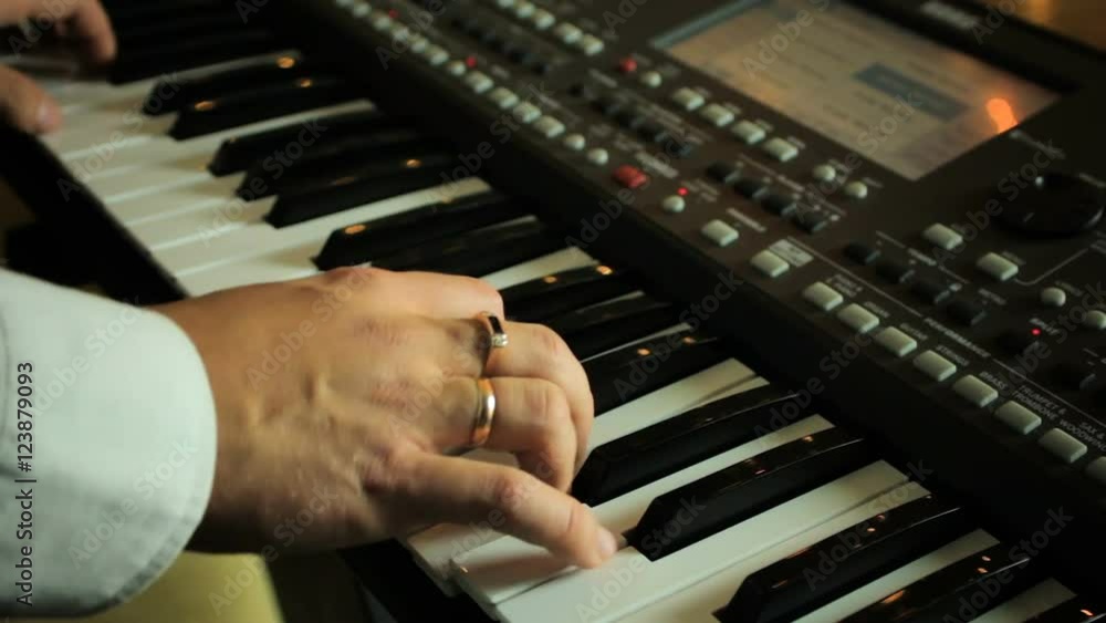 A man playing on a synthesizer electronic piano, hands close-up Stock ...