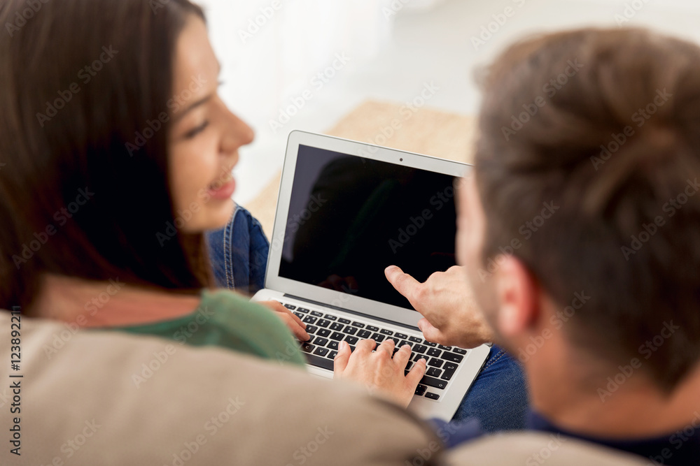 Watching something on a laptop Stock Photo | Adobe Stock