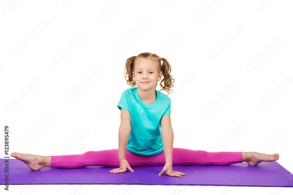 Little girl sitting on the splits Stock Photo | Adobe Stock