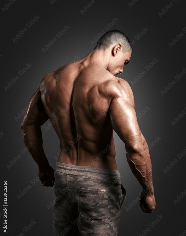 Muscled male model showing his back Stock Photo | Adobe Stock