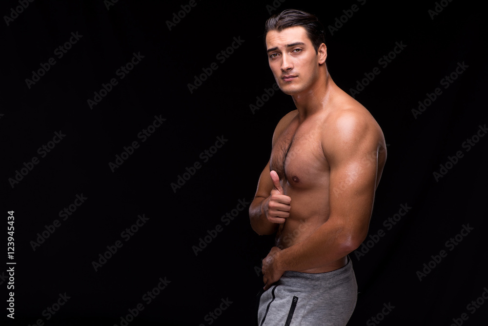Ripped muscular man on black background Stock Photo | Adobe Stock