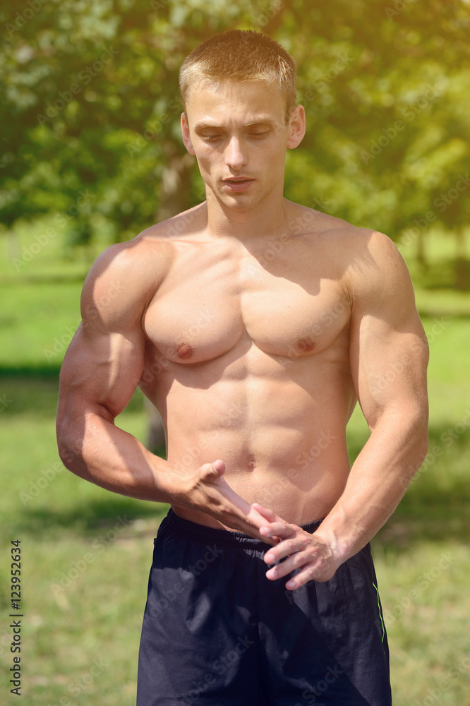 Muscular man practice street workout in an outdoor gym Stock Photo ...