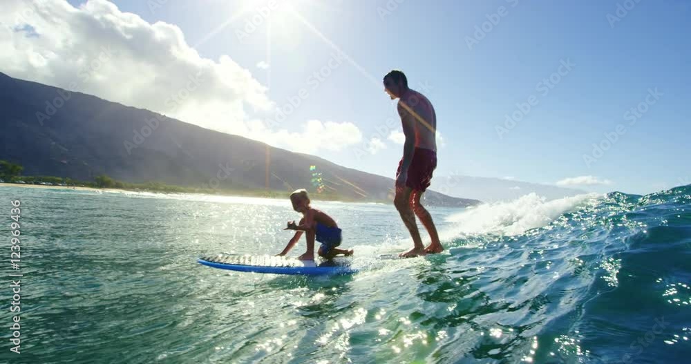 Father and son having fun surfing together, summer lifestyle family ...