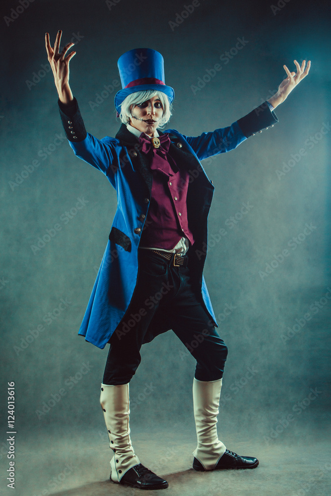 Smiling circus actor in blue tuxedo is presenting something. Stock ...