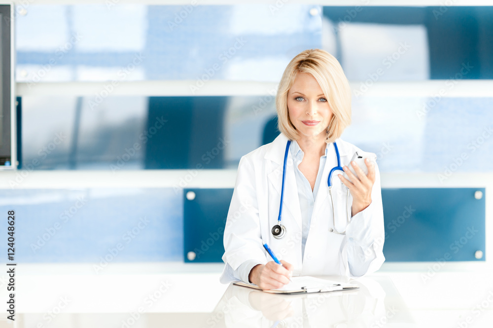 Attractive blonde female woman doctor nurse practitioner in lab coat ...