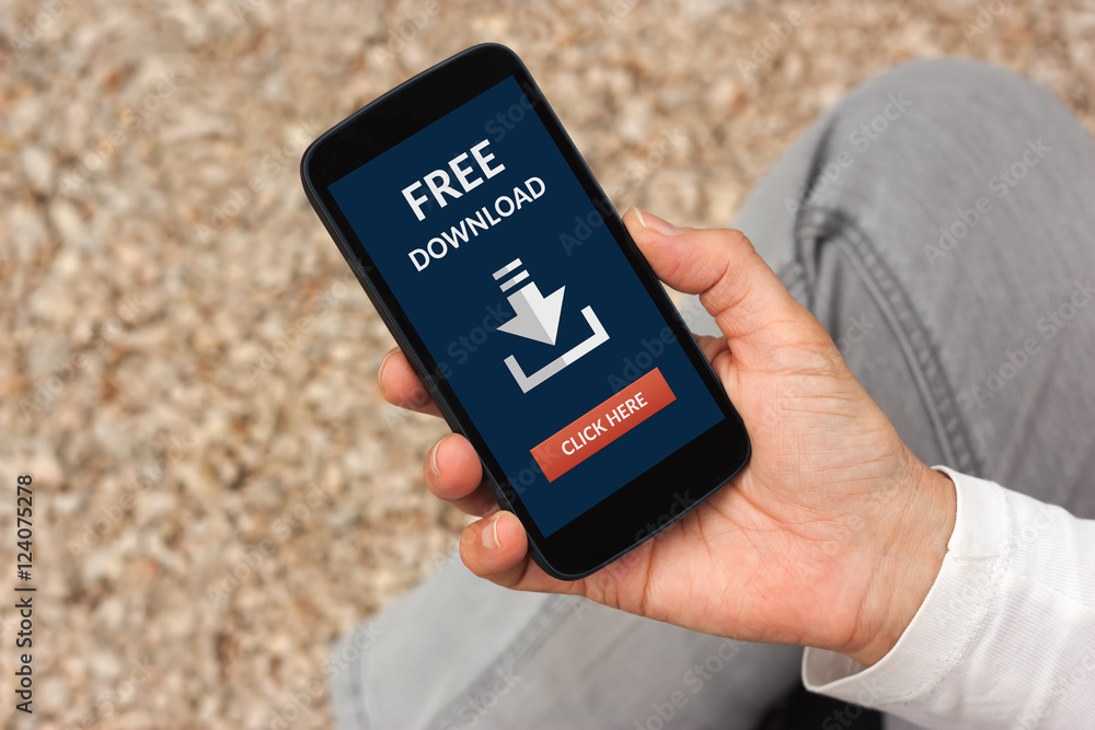 Hand holding smart phone with free download concept on screen. All ...