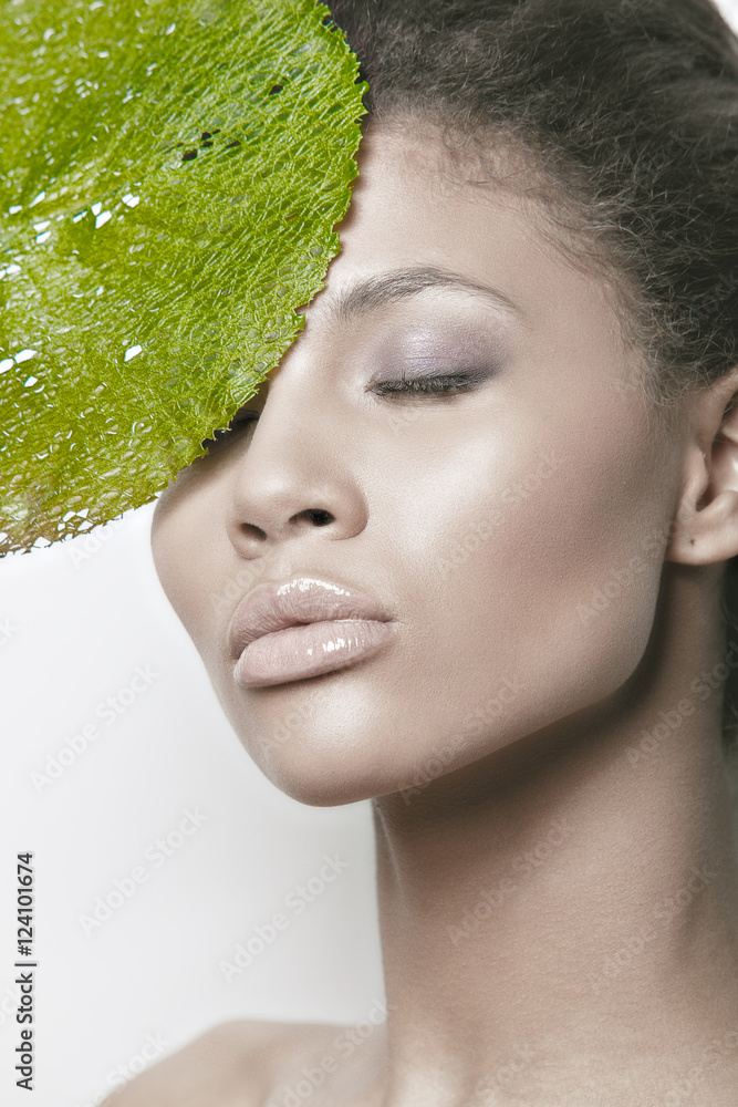Beauty studio portrait of a beautiful metis young woman with smooth ...