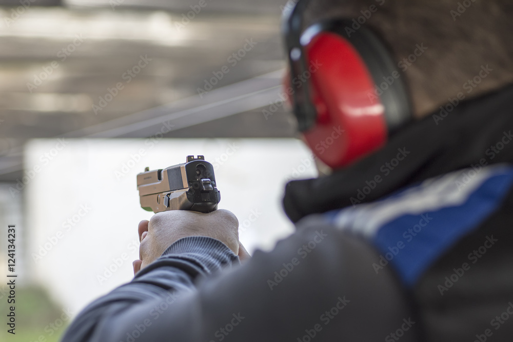 Shooting with Gun at Target in Shooting Range. Man Practicing Fire ...