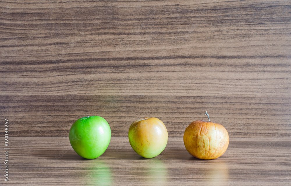 monkey apple on wood board , fresh fruit medium withered fruit and ...