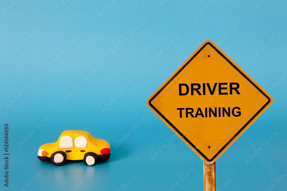 Driver Training sign with yellow car clay model Stock Photo | Adobe Stock