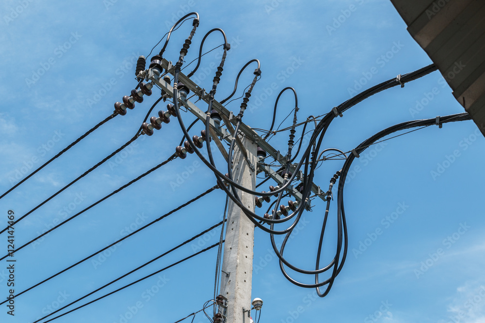 High-voltage wires on a light pole. Stock Photo | Adobe Stock